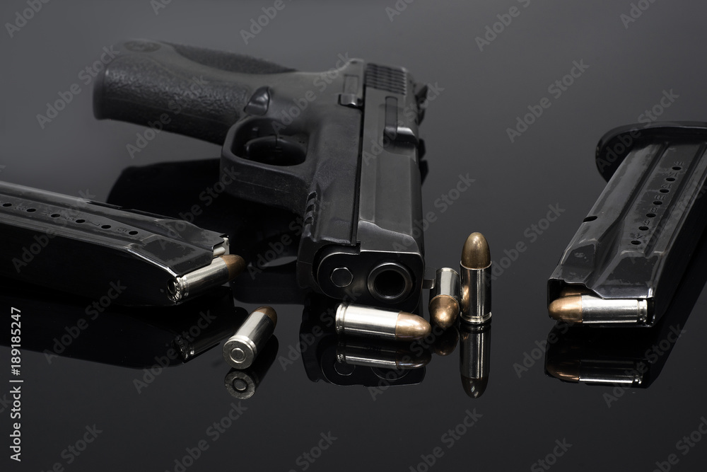 9mm Pistol gun with ammunition, Bullets and magazine on black ...