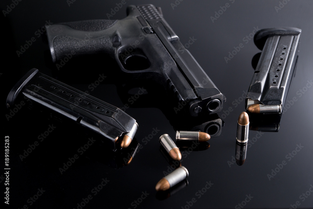 9mm Pistol gun with ammunition, Bullets and magazine on black ...