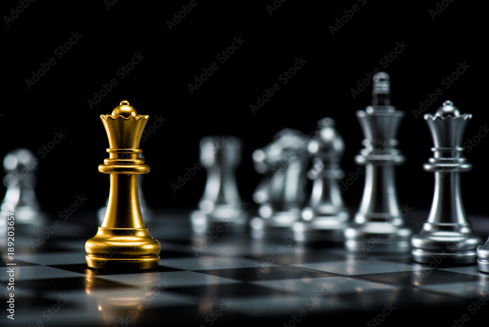 One chess pieces staying against full set of black chess pieces Stock ...
