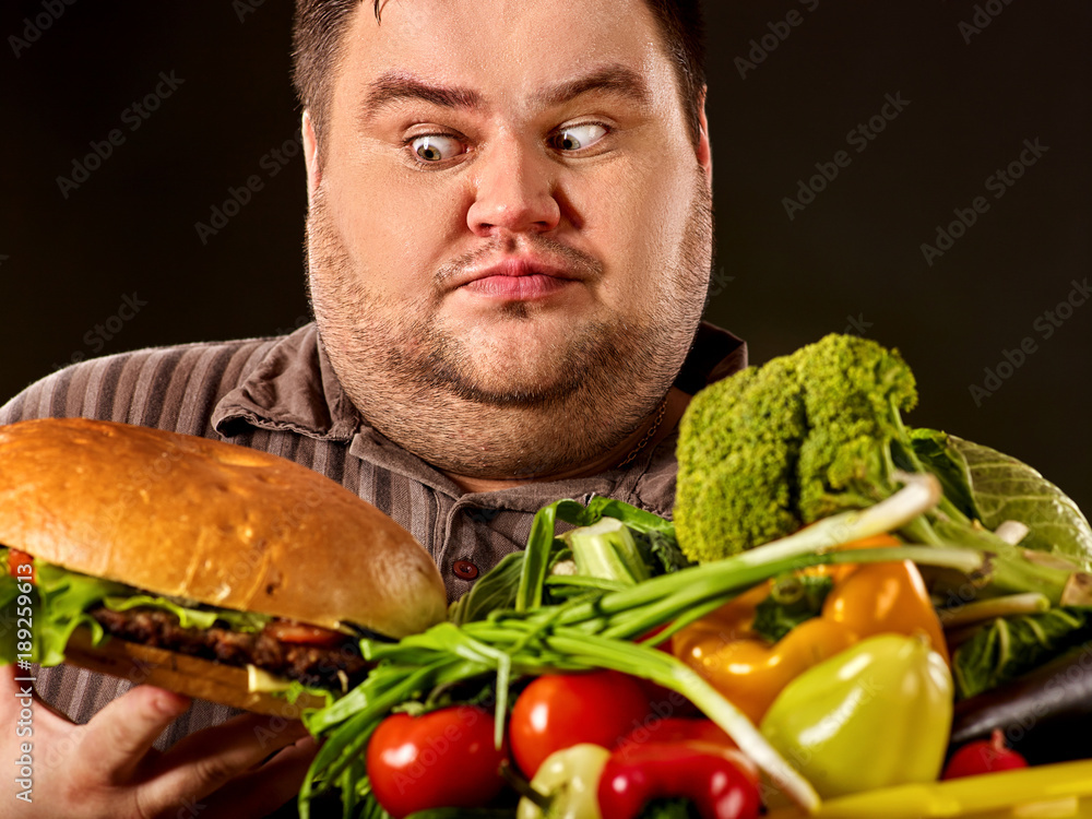 Diet fat man who makes choice between healthy and unhealthy food ...