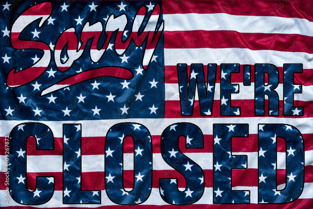 government shutdown represented by a sorry we're closed sign outline ...