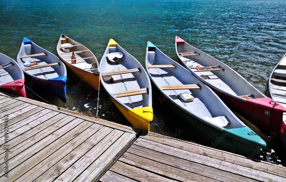 Abstract of Colorful boats docked ready for tourist canoeing experience ...