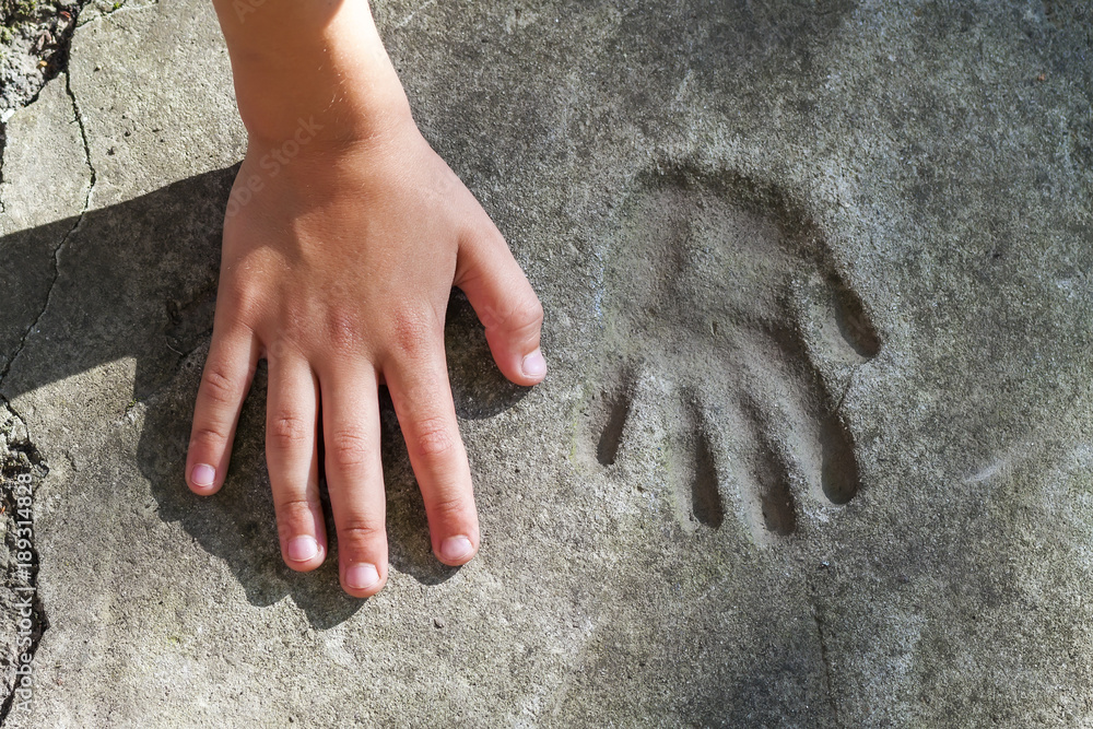 Childs hand and memorable handprint in concrete Stock Photo | Adobe Stock