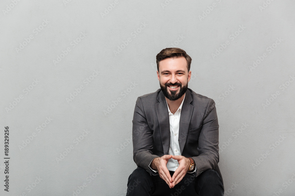 Cropped portrait of relaxed man resting while sitting on chair in ...