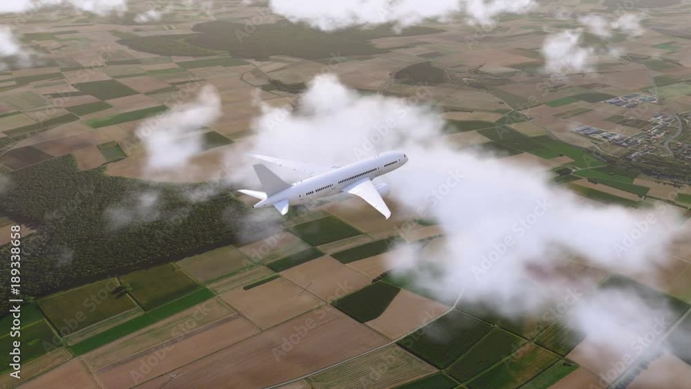 White brandless passenger airplane flies in the cloudy sky above ...