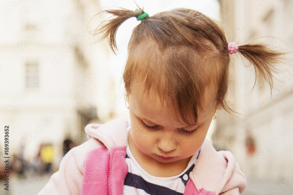 Portrait of little cute child girl expressing sadness (Gestures, body ...