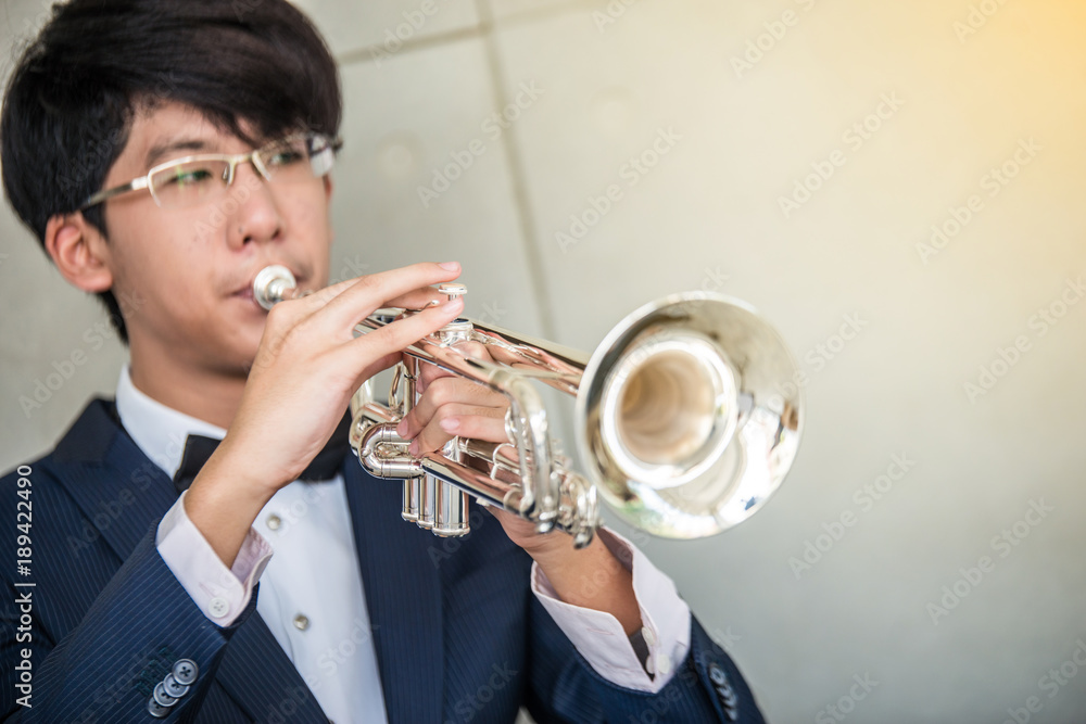 Trumpet instrument and Musician playing a trumpet in studio Stock Photo ...