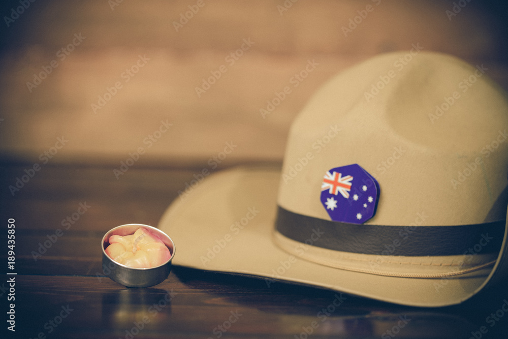 Anzac army slouch hat with Australian Flag on vintage wood background ...