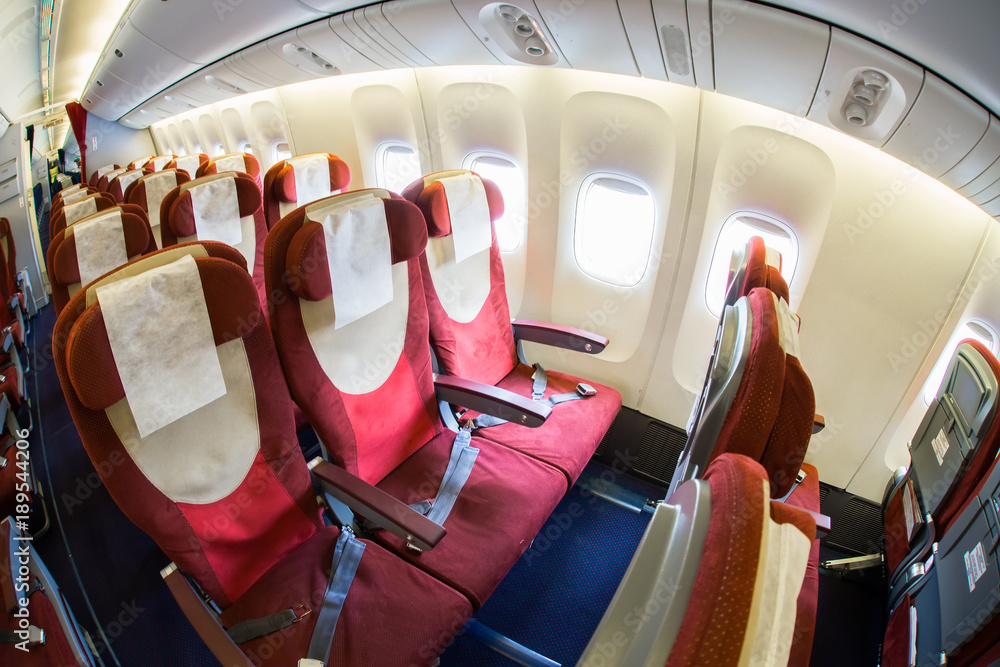 Economy class cabin in a large civil widebody airplane. Stock Photo ...