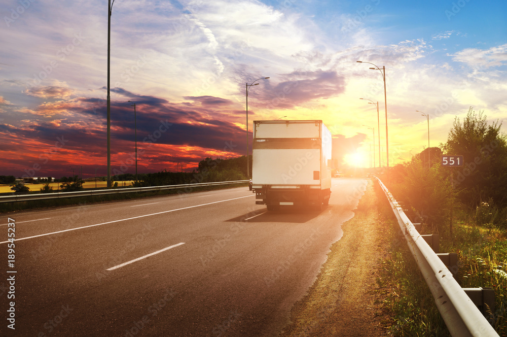 Box truck on the countryside road against night sky with sunset Stock ...