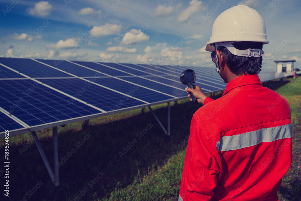 engineer checking heat of solar panel and using ir camera to scan ...