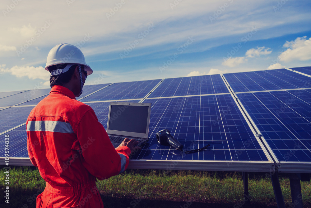 Plakát engineer checking heat of solar panel and using ir camera to ...