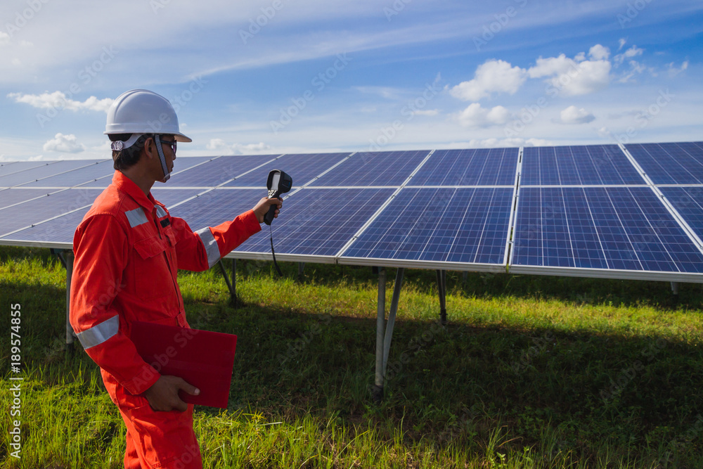 engineer checking heat of solar panel and using ir camera to scan ...