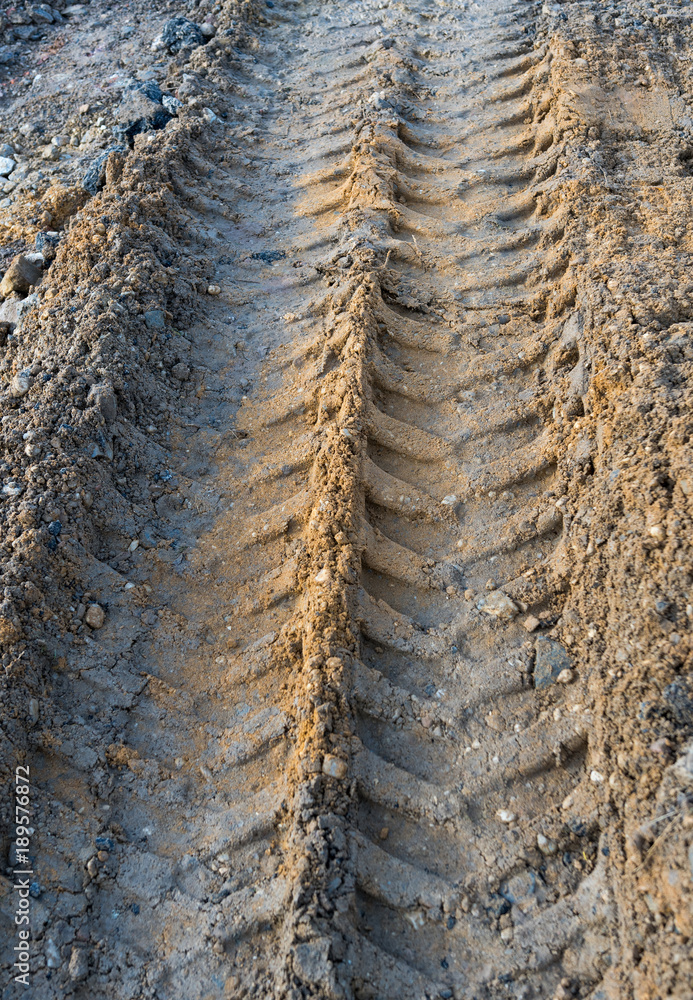 Reifenspur auf einer Baustelle Stock Photo | Adobe Stock