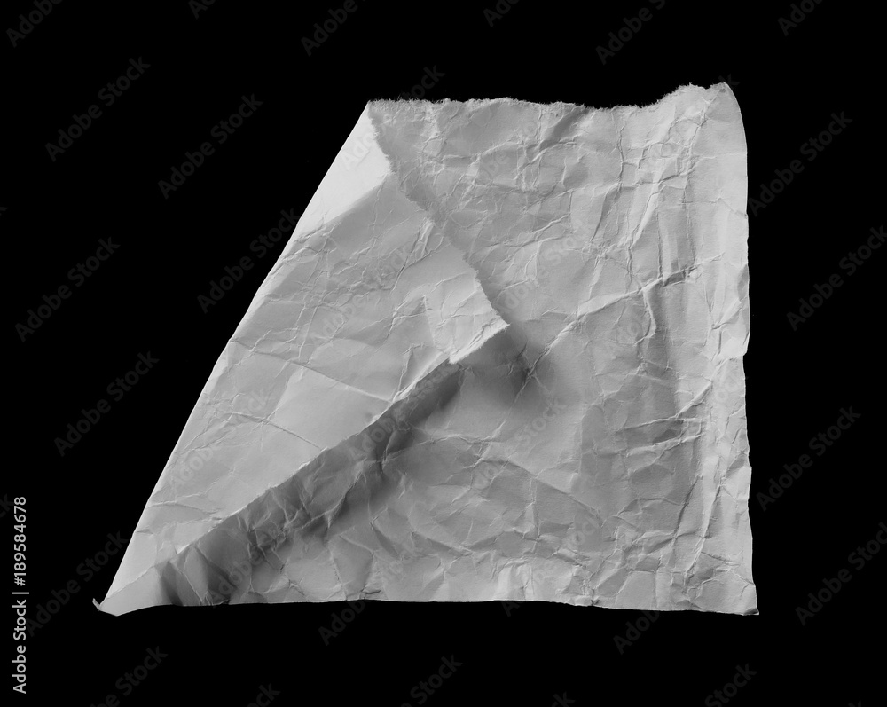 Crumpled paper scrap wrapping isolated on black background with ...