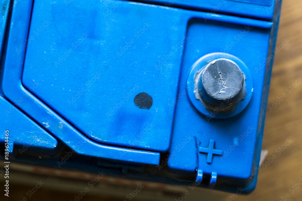 Terminals of the old battery. Charging car battery with electric ...