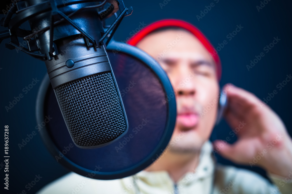 asian handsome male singer singing in recording studio or DJ chatting ...
