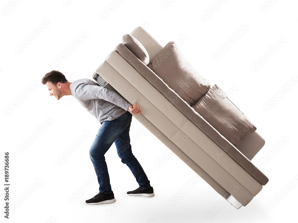 Side View Of A Man Lifting Sofa Stock Photo | Adobe Stock