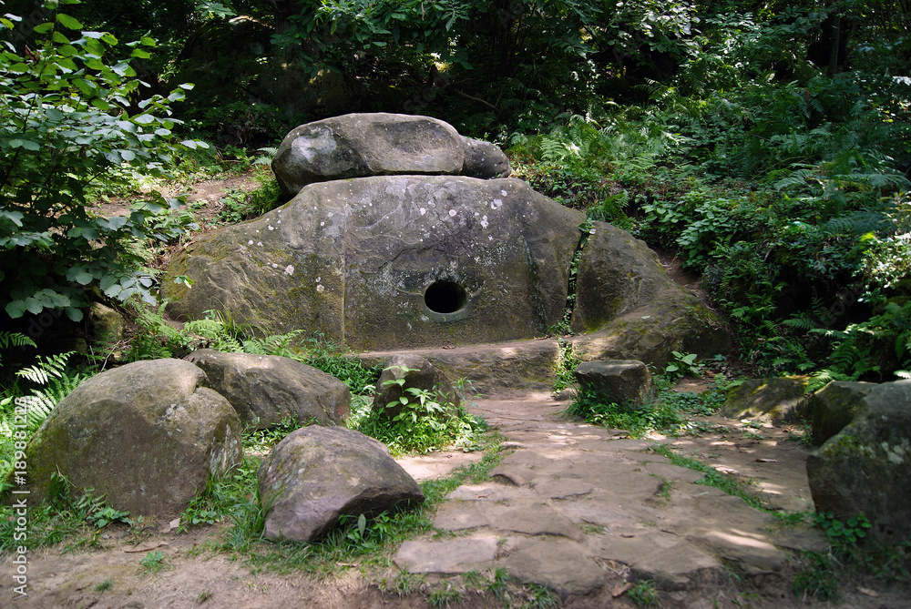 Ancient monolithic dolmen (single-chamber megalithic tomb) with a round ...