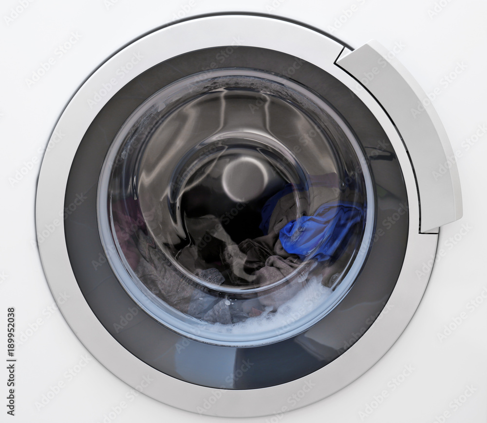 Washing machine with clothes, closeup. Laundry day Stock Photo | Adobe ...