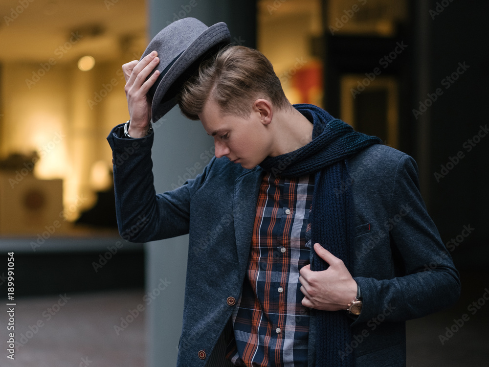 Stylish young man taking off his hat. Fashionist and trend setter. Love ...