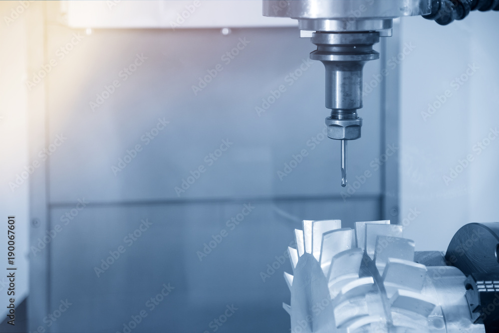 The 5-axis CNC machine cutting the sample part.The aero spaces part ...