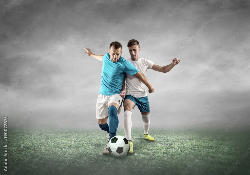 Soccer player on a football field in dynamic action at summer da Stock ...