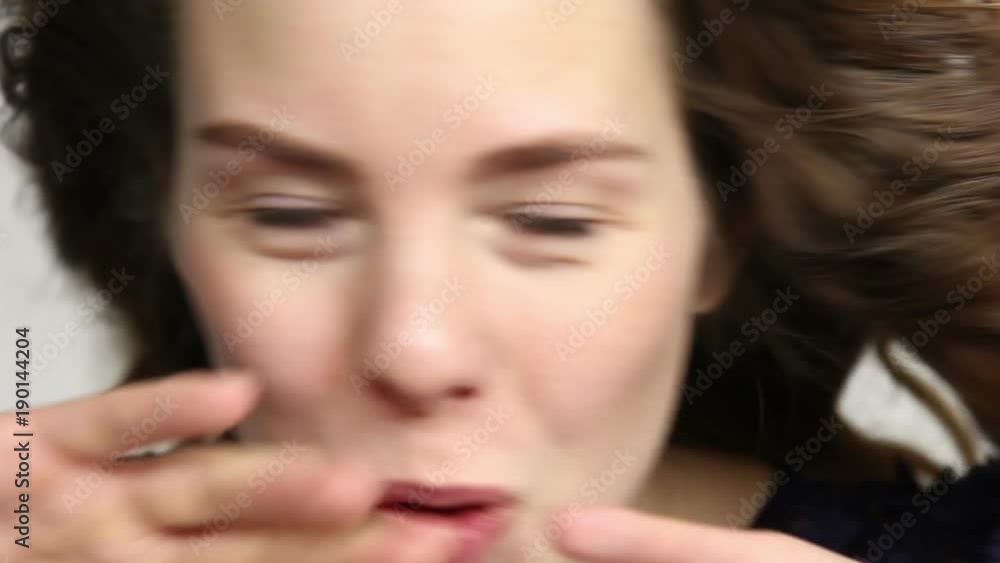 Girl fooling around, Close-up lips of crop woman kissing her hands ...