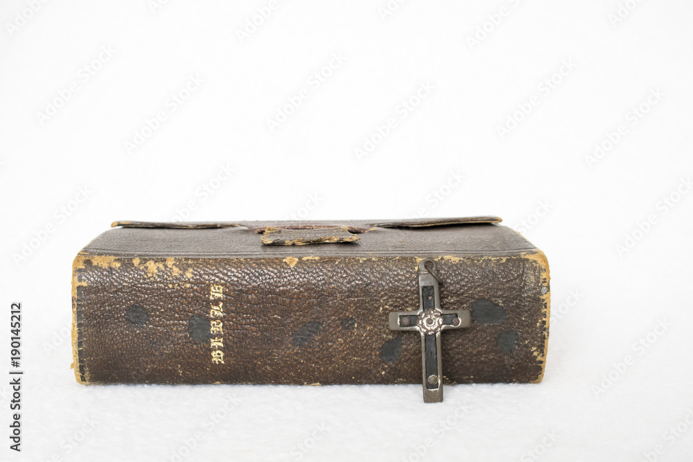 Antique Worn Leather Bible with Antique Cross Metal and Wood on White ...