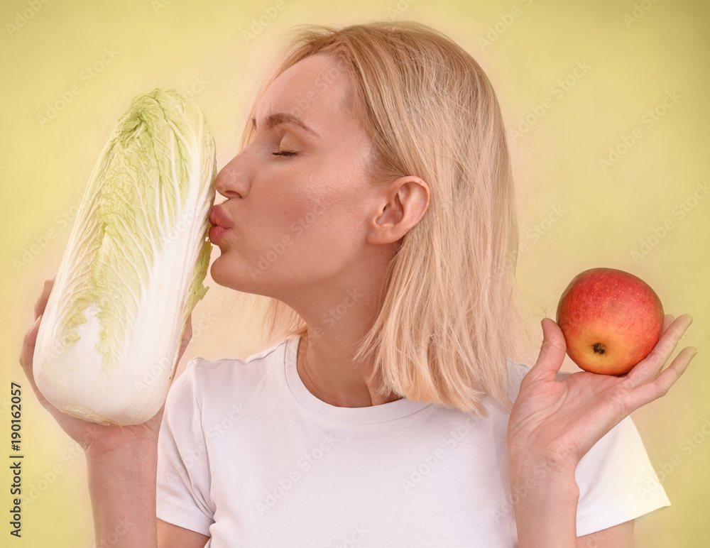 Beautiful healthy blonde woman with blue eyes and red lips in a white t ...