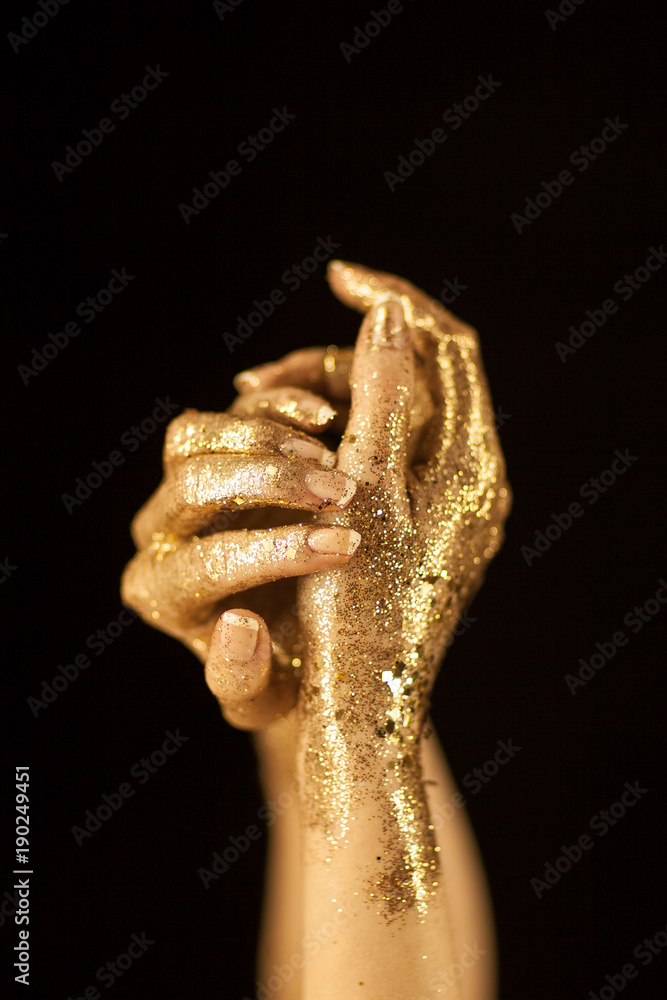 Beautiful woman hands gold, golden hands, glitter posing like ballet ...