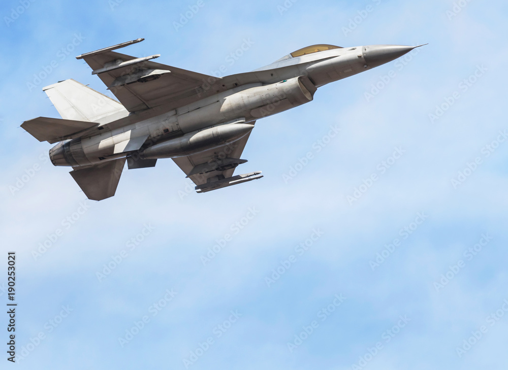 falcon fighter jet military aircraft flying on blue sky background ...