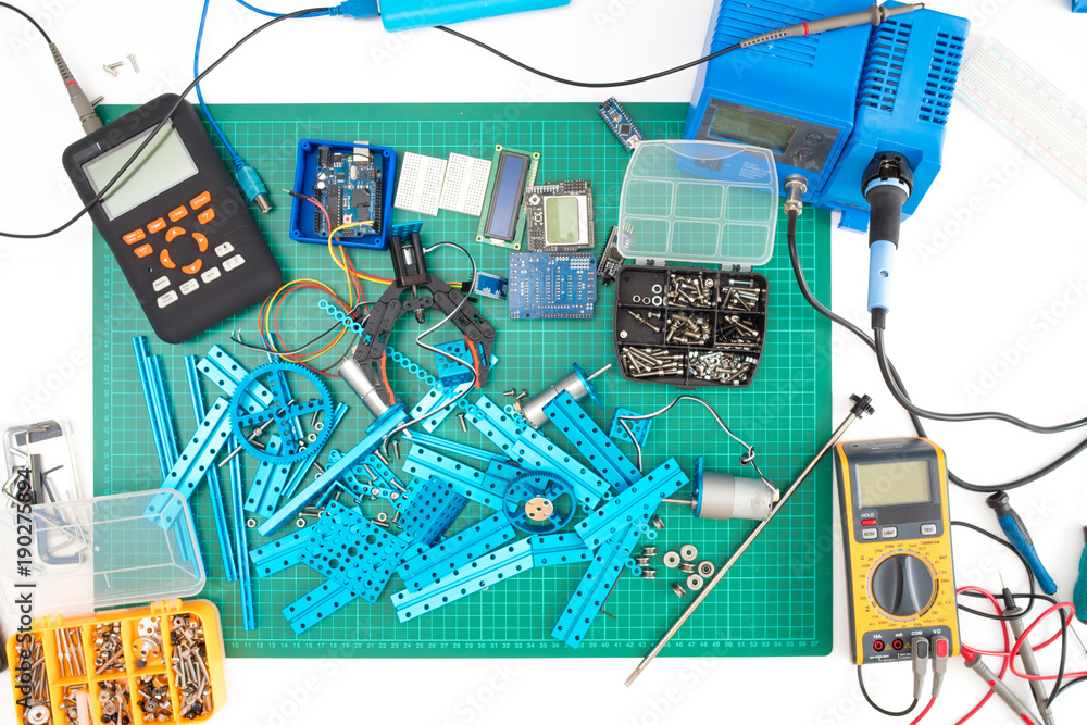 manual assembly of electronic mechanical device from a set of spare ...