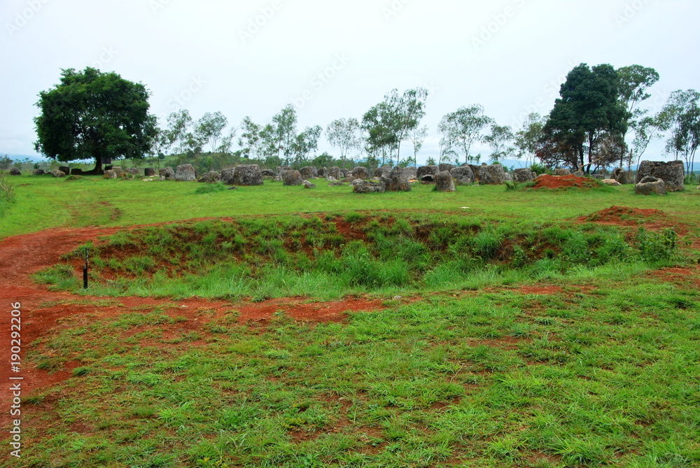 Bomb craters from the Vietnam War surround giant megalithic stone urns ...