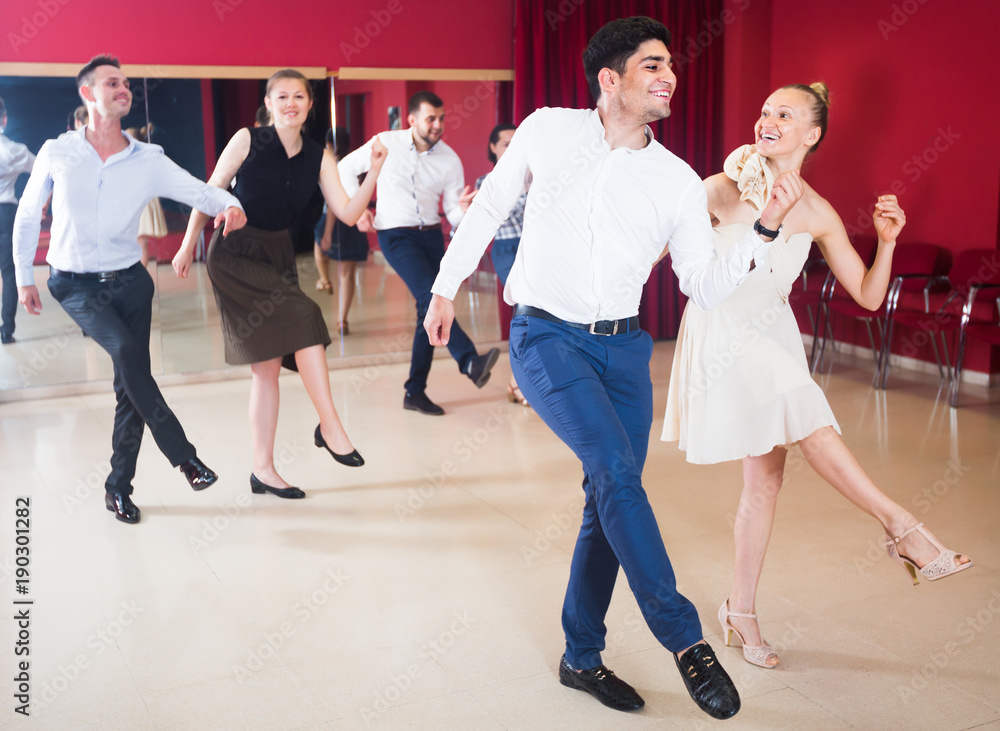 Young people practicing vigorous jive movements Stock-Foto | Adobe Stock