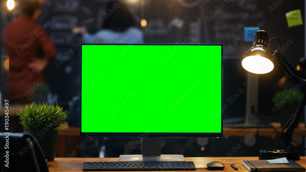 Personal Computer with Mock-up Green Screen Monitor Stands on the ...