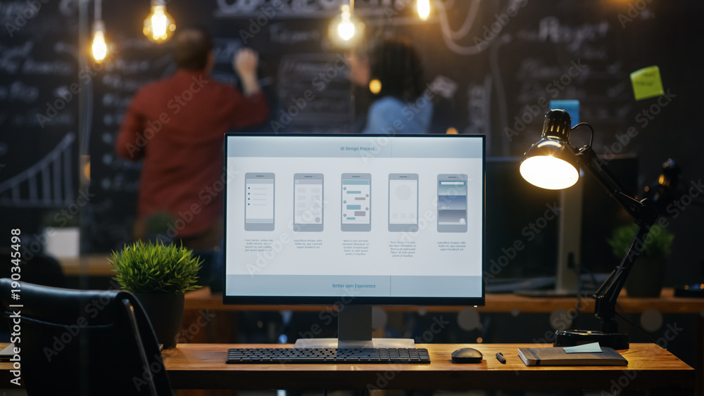 Personal Computer with Mobile Application Design Showing on the Monitor ...