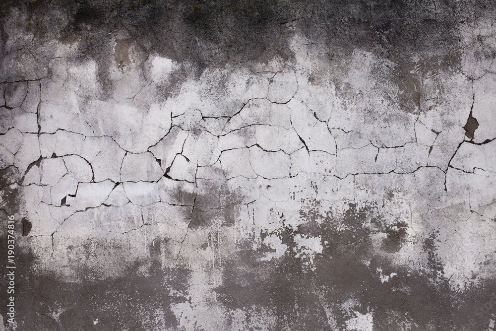 Foto de Old concrete wall with cracks. Aged cracked plaster wall background and texture style ...