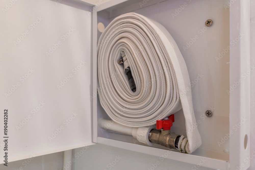 Fire safety in the apartment. White hose in the water drawer to ...