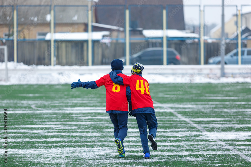 Young kids football tournament - children play match on soccer field ...
