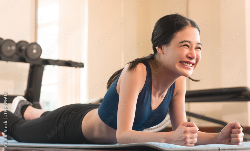 Cute asian girl laughing while working out in the gym Stock Photo ...