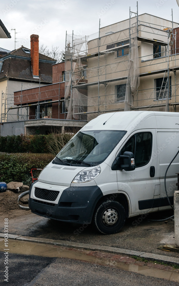 Detail of white van parked near a modern house construction site Stock ...