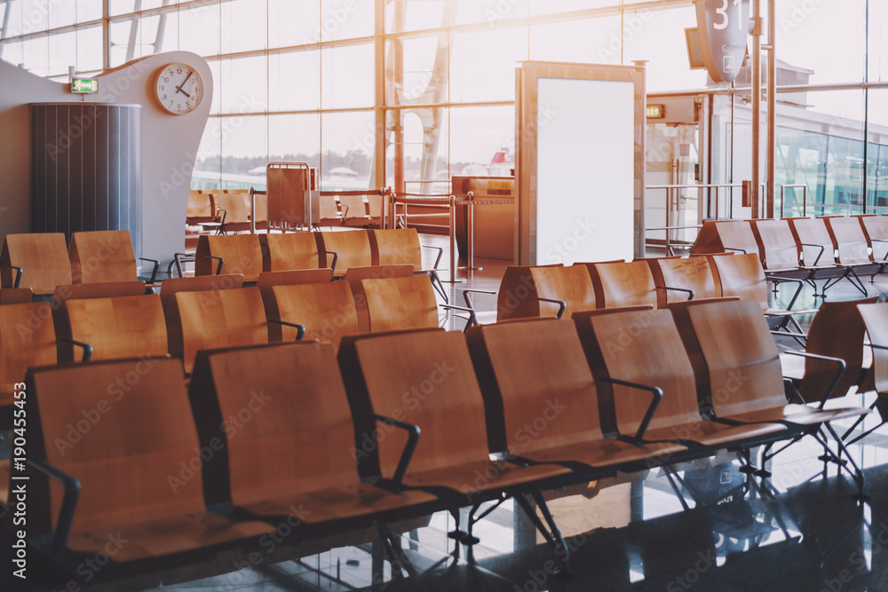 Empty rows of seats in departure area or waiting hall of modern airport ...