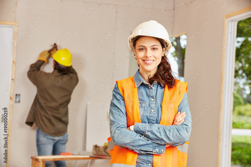 Junge Frau als Handwerker Lehrling Stock Photo | Adobe Stock