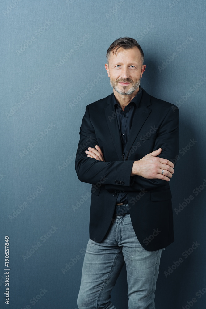 Confident middle-aged man in jeans and jacket Stock Photo | Adobe Stock