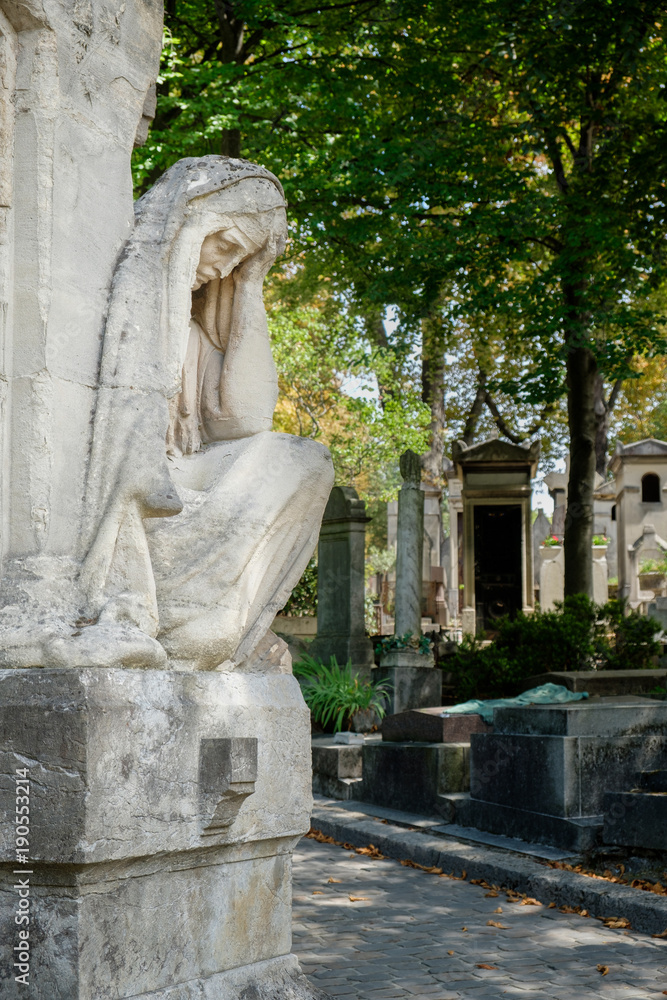 Statue of a sad woman on the Pere Lachaise cemetery in Paris Stock ...