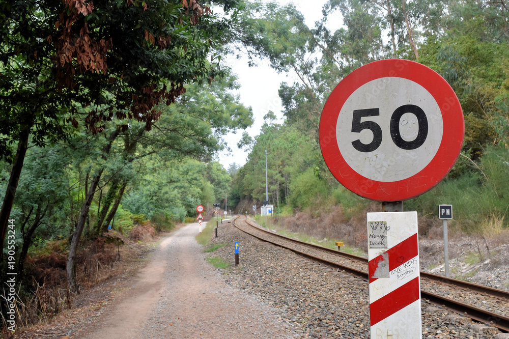 Railroad Speed Limit Sign along tracks in Spanish woodland Stock Photo ...
