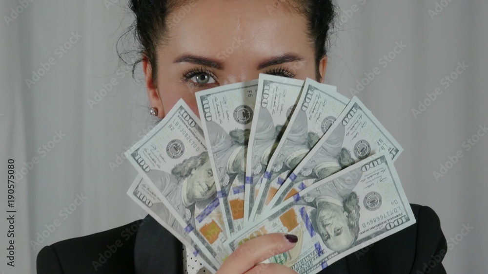 Happy Business Woman Displaying a Spread of Cash. Successfuly girl wins ...