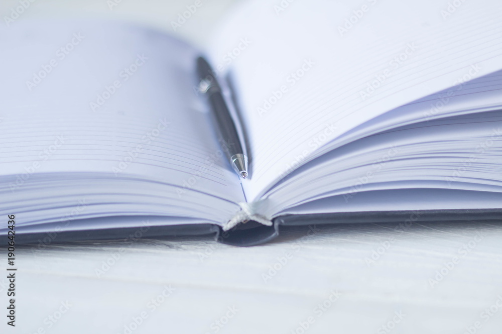 pen and a notebook at the workplace Stock Photo | Adobe Stock