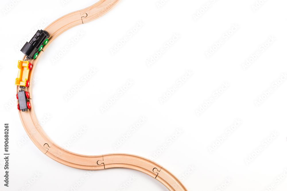 Toy train on curve wooden railways. Top view. Stock Photo | Adobe Stock
